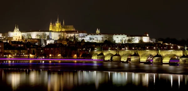Vltava river, Charles Bridge (Stone Bridge, Prague Bridge) and St. Vitus Cathedral at night ...