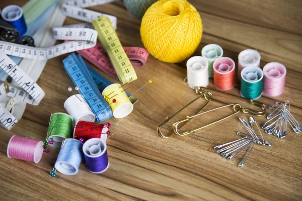 Sewing machine. Colorful threads, needles, pins, buttons. - Stock Image ...