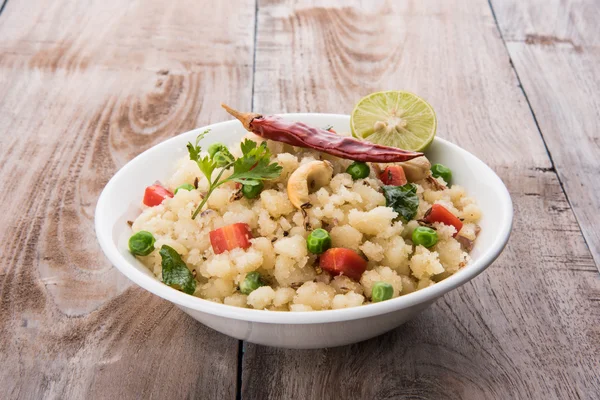 Upma or upama or uppuma, favourite south indian sweet and salty breakfast menu or snacks - Stock ...