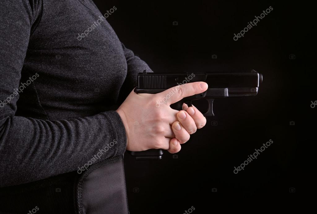 Woman hand with gun pulled — Stock Photo © eAlisa #72134767
