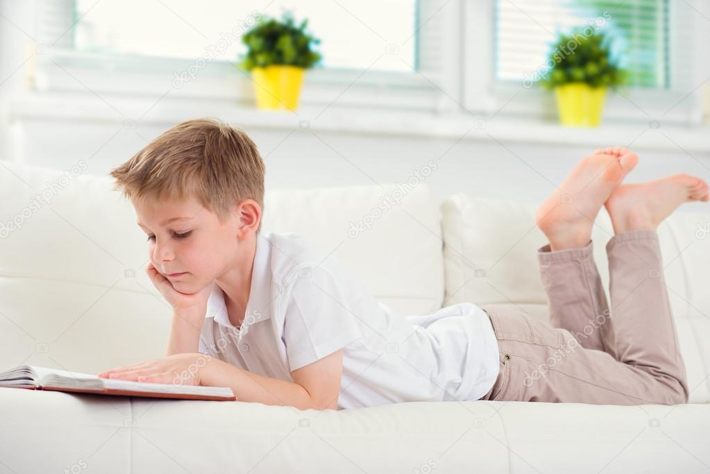 Cute little boy studying at home — Stock Photo © petrograd99 #118673728
