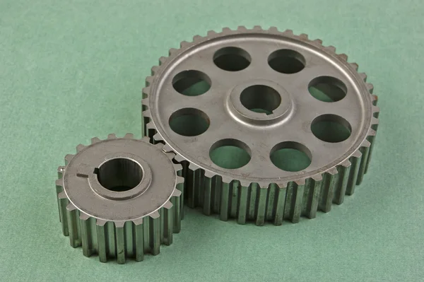 Two gears on a green background Stock Photo by ©Observer 25721795