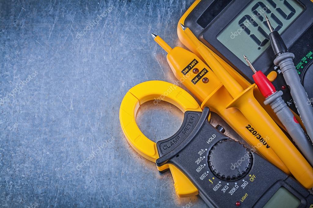 Digital clamp meter and electrical tester Stock Photo by ©mihalec 102037114