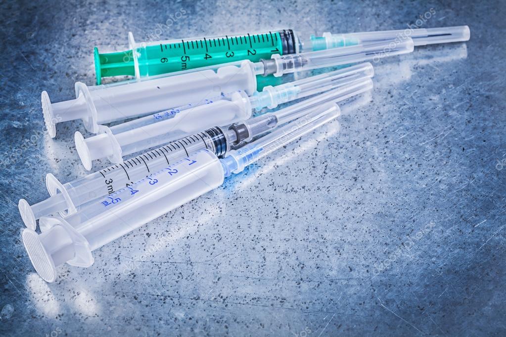 Medical single-use needle injectors Stock Photo by ©mihalec 103607708