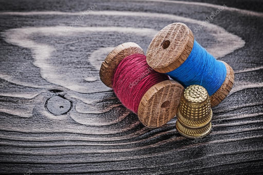 Vintage spools of thread thimbles Stock Photo by ©mihalec 106159412