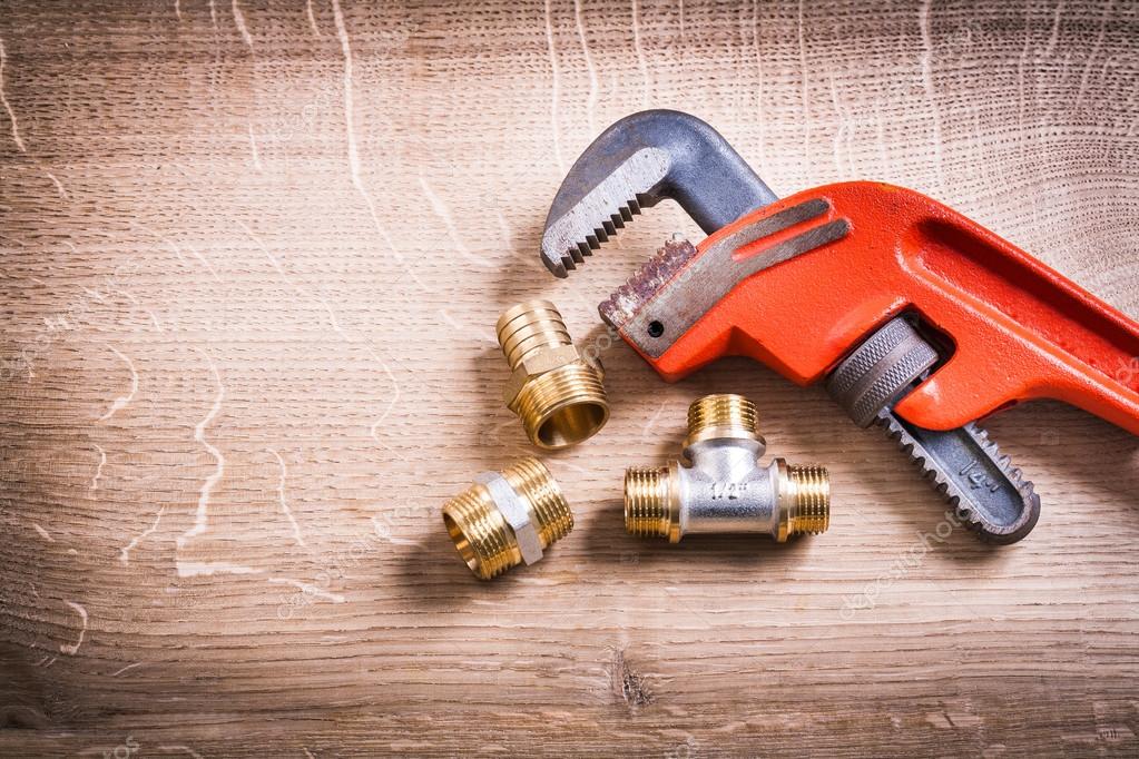 Monkey Wrench And Brass Pipe Connectors — Stock Photo © mihalec #71281309