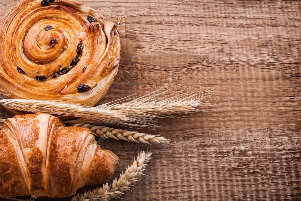 Wheat ears raisin bun, croissant Stock Photo by ©mihalec 73635089