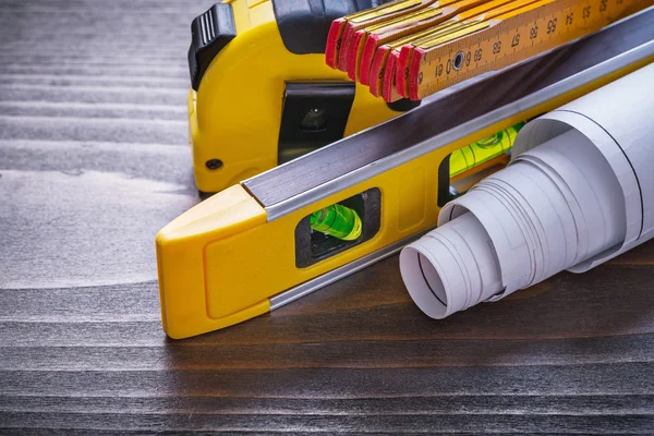 Blueprints, construction level and wooden meter - Stock Image - Everypixel