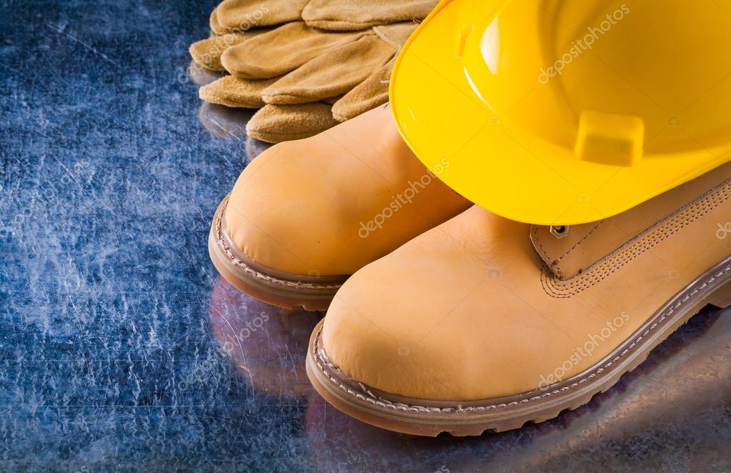 Safety boots, gloves and working helmet Stock Photo by ©mihalec 80368498