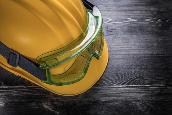 Building helmet on wood - Stock Image - Everypixel