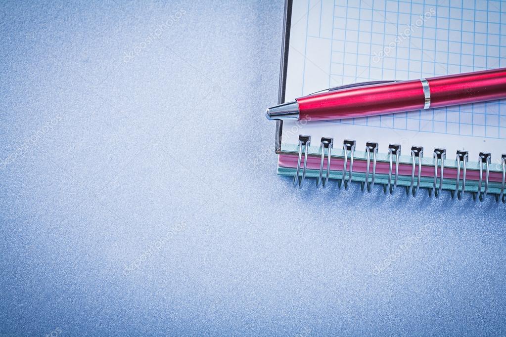 Red ballpoint pen and notepad Stock Photo by ©mihalec 97868840