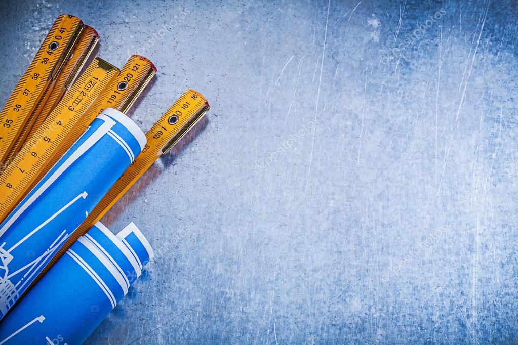 Construction drawings and wooden meter Stock Photo by ©mihalec 98775456