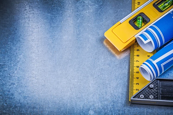 Measuring tape, blueprints and construction level Stock Photo by ...
