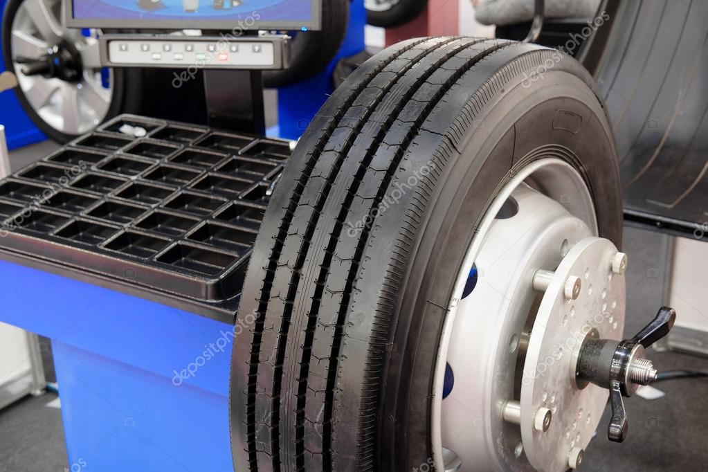 Wheel on a tire machine Stock Photo by ©uatp12 121831252