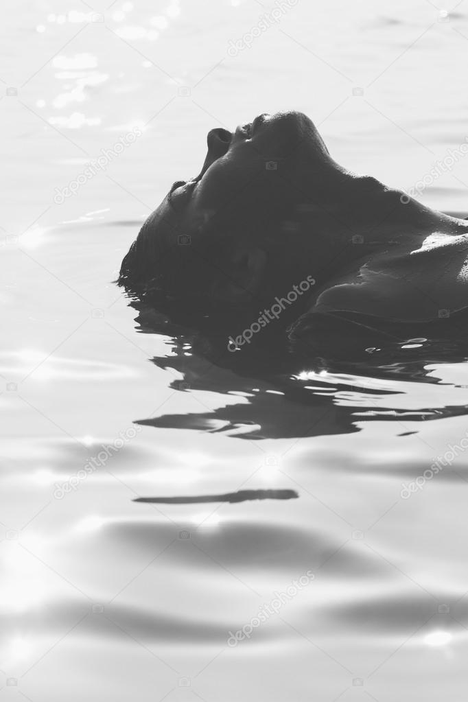 Woman floating on water — Stock Photo © Victor_Tongdee #72069757