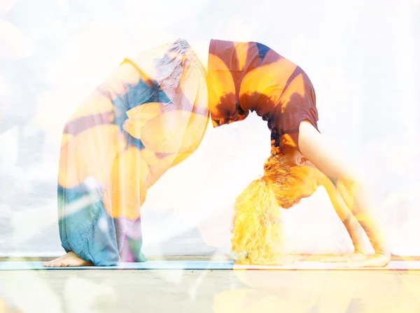 Woman performing back bend - Stock Image - Everypixel