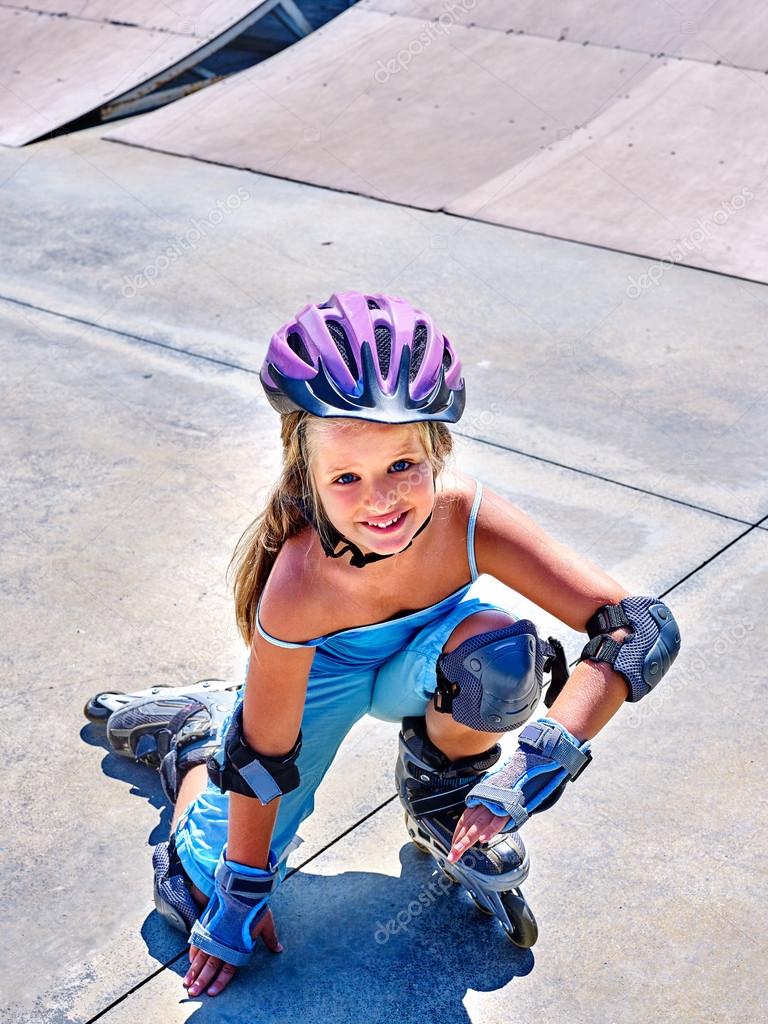 Girl rides on roller skates. Stock Photo by ©poznyakov 106014022