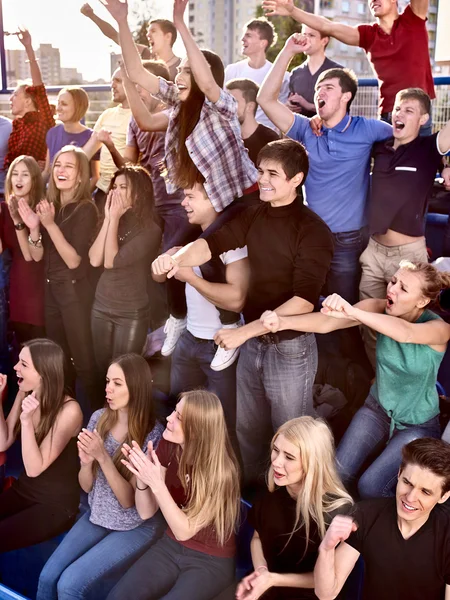 Sport fans clapping and singing on tribunes. - Stock Image - Everypixel