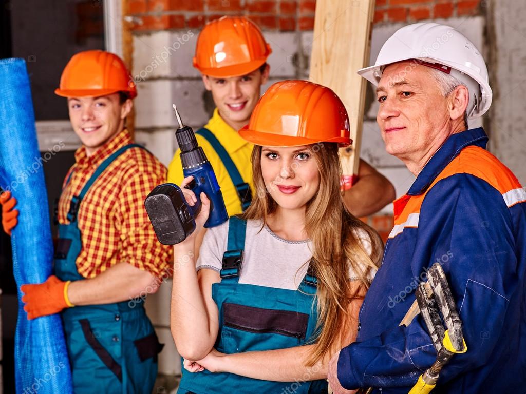 Group people in builder uniform. Stock Photo by ©poznyakov 73849303