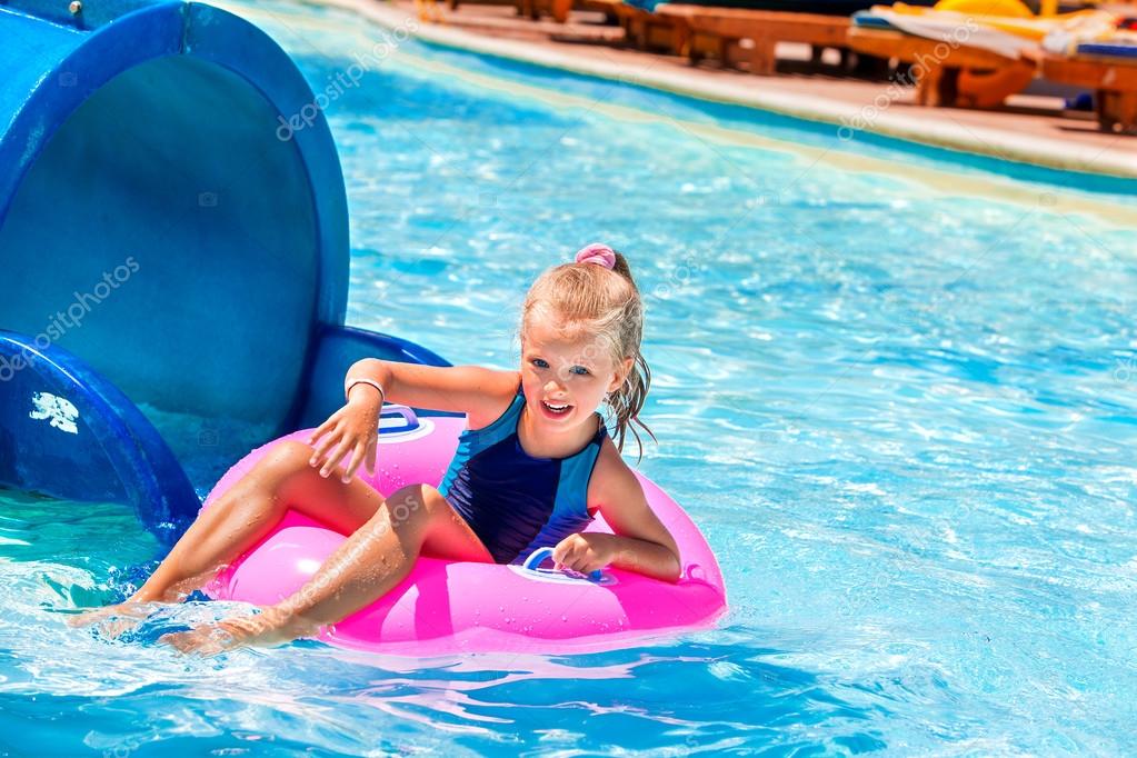 Kid sitting on inflatable ring. — Stock Photo © poznyakov #75129277