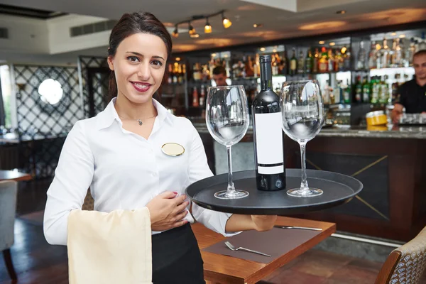 Waitress with dish of champagne glasses Stock Photo by ©MNStudio 88377642