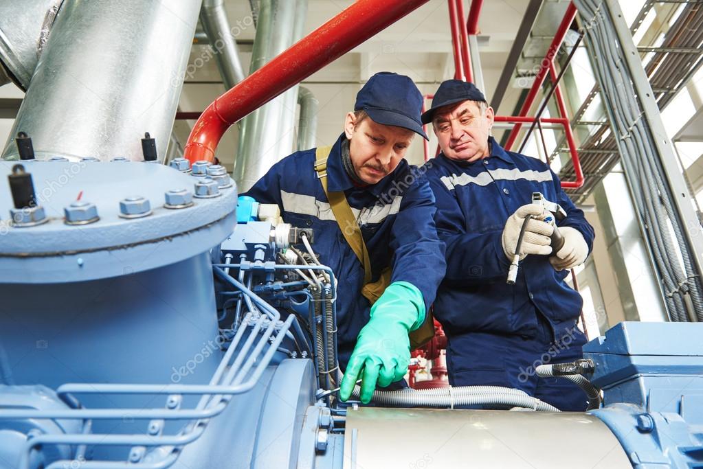 Service workers at industrial compressor station — Stock Photo ...