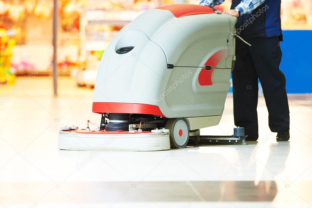 Worker cleaning store floor with machine — Stock Photo © kalinovsky ...