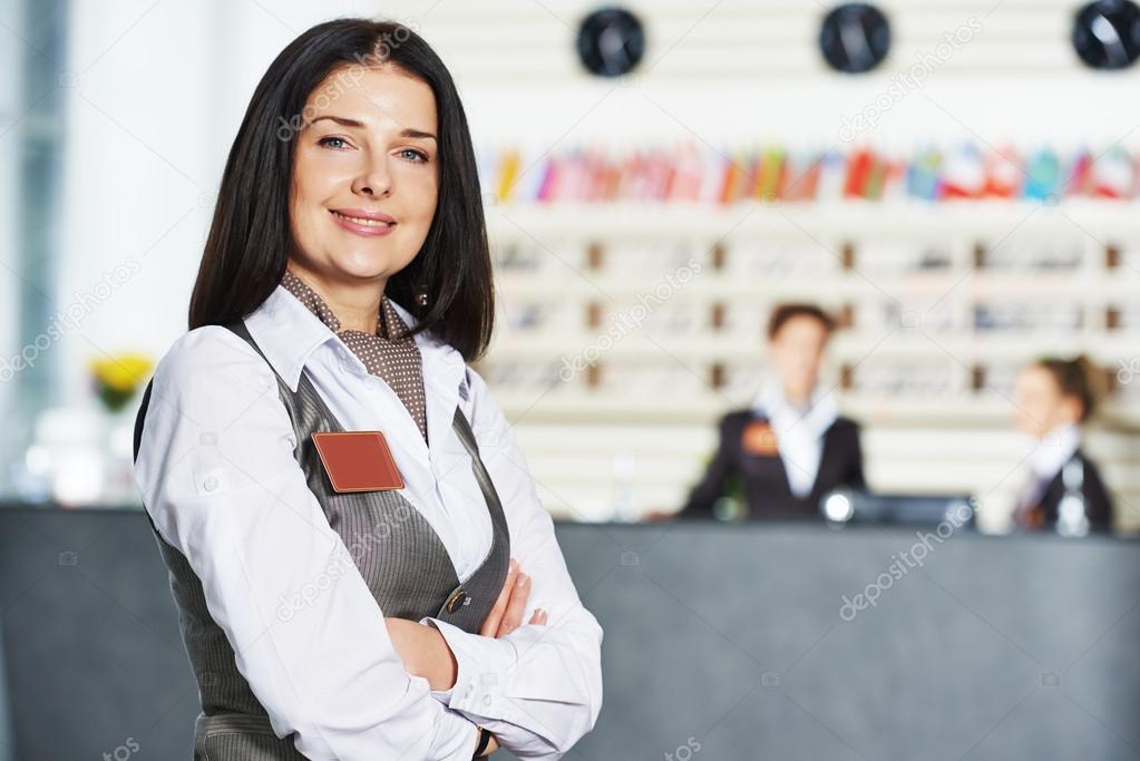 Hotel manager on reception Stock Photo by ©kalinovsky 73238645
