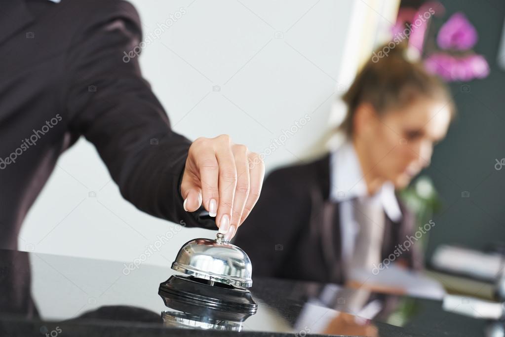 Hotel worker on reception Stock Photo by ©kalinovsky 75473231