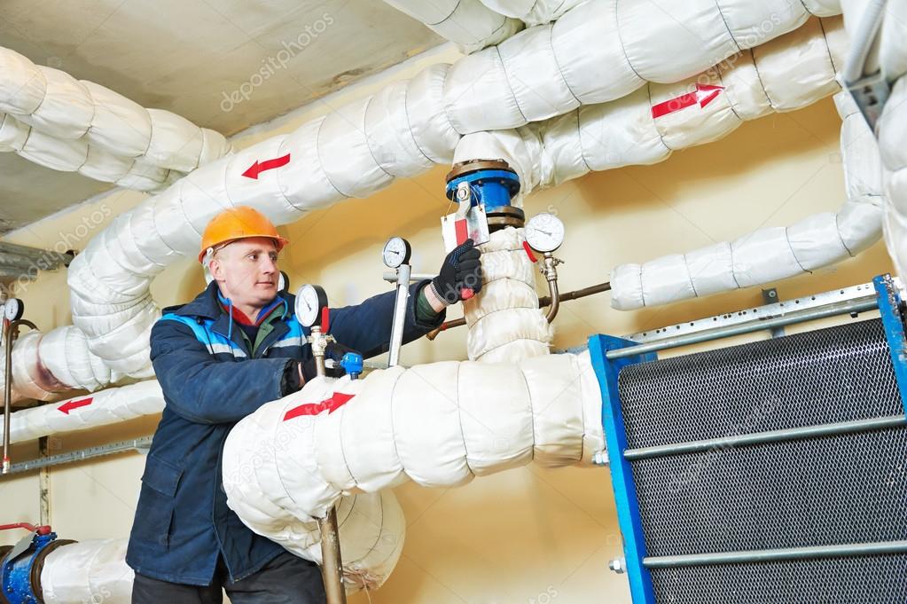 Heating engineer repairman in boiler room — Stock Photo © kalinovsky ...