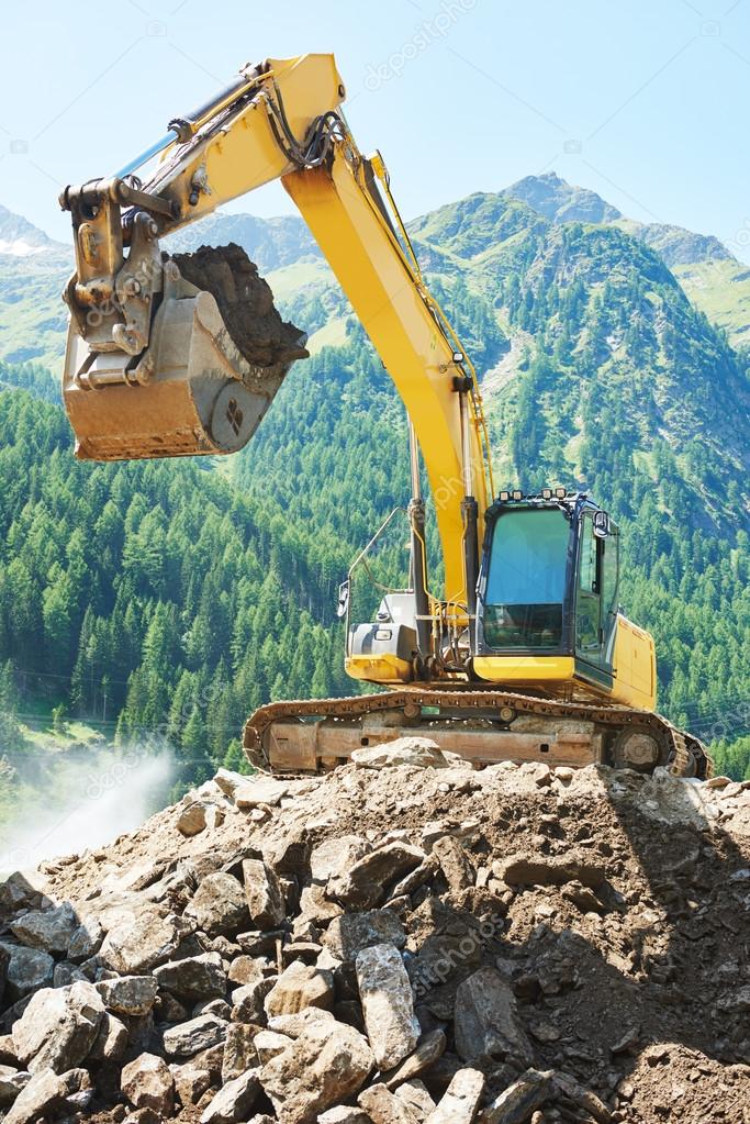 Excavator loader machine at construction site Stock Photo by ...