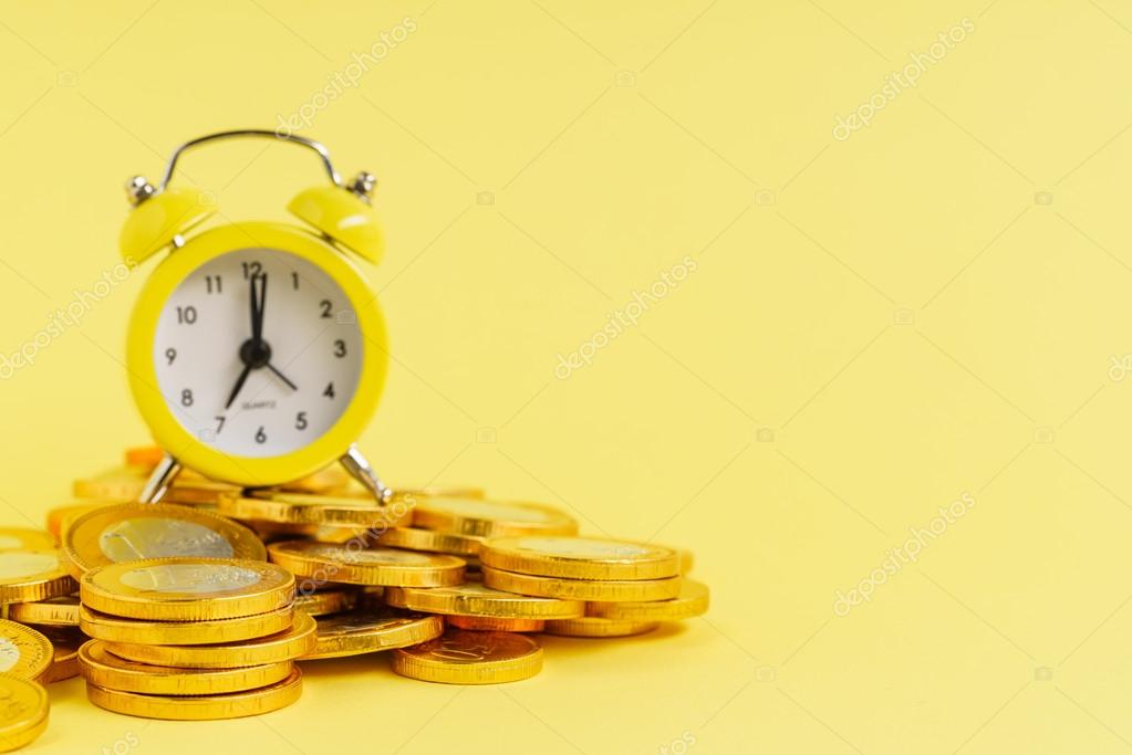 Alarm clock and coins — Stock Photo © Shebeko #122257668
