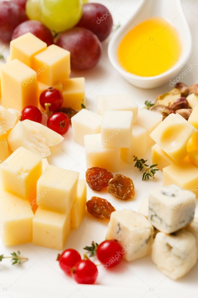 Cheese slices on plate Stock Photo by ©Shebeko 59473243
