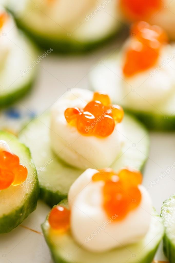 Canapes with caviar and cucumber Stock Photo by ©Shebeko 68308043