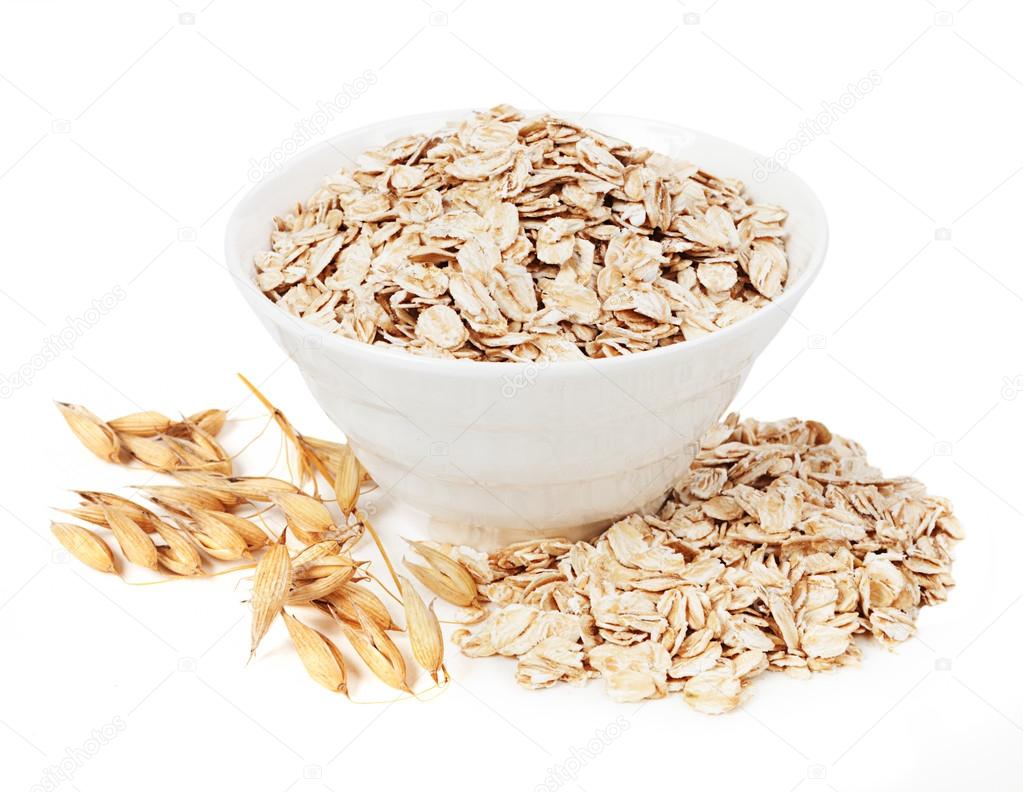 Rolled oats in plate Stock Photo by ©Timmary 61824541