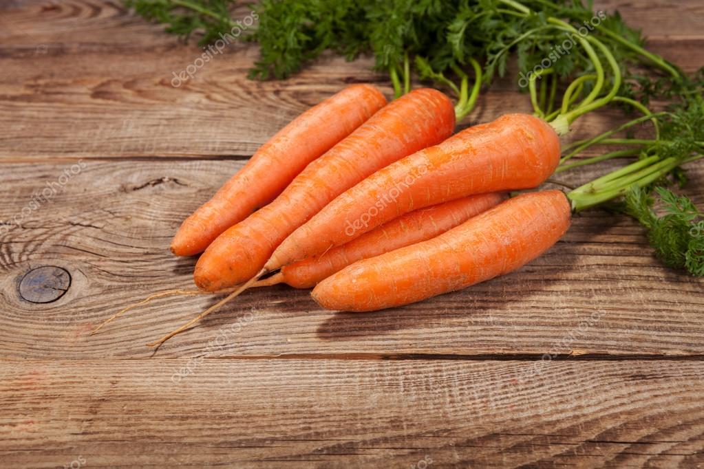 Carrot on the old table Stock Photo by ©Timmary 79651112