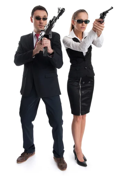Man and woman with guns Stock Photo by ©alanpoulson 102087310