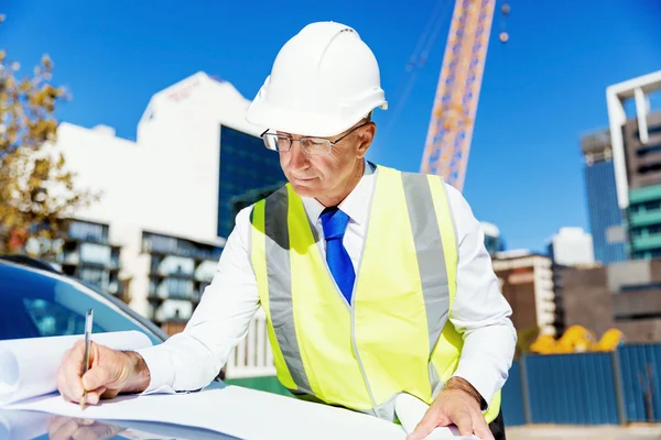 Engineer builder at construction site — Stock Photo © SergeyNivens ...