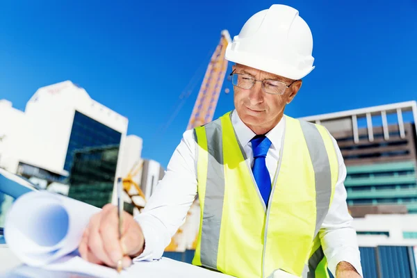 Engineer builder at construction site — Stock Photo © SergeyNivens ...