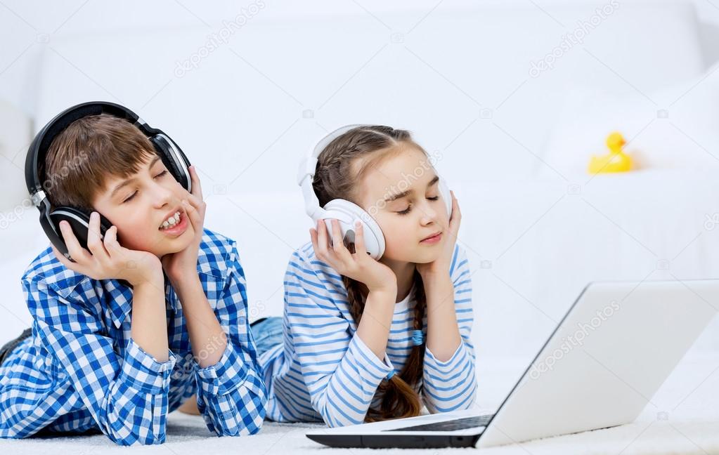 Cute kids using devices Stock Photo by ©SergeyNivens 101243540