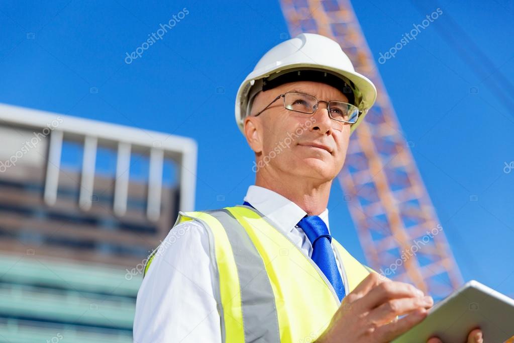Engineer builder at construction site Stock Photo by ©SergeyNivens ...