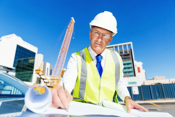 Engineer builder at construction site — Stock Photo © SergeyNivens ...