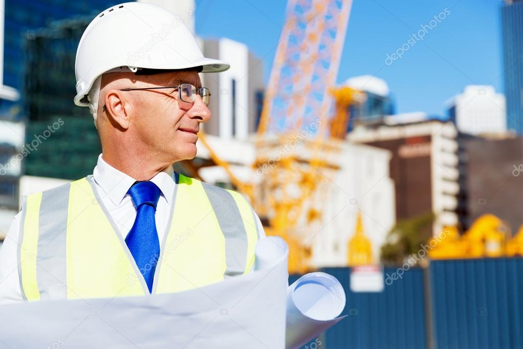 Engineer builder at construction site Stock Photo by ©SergeyNivens ...