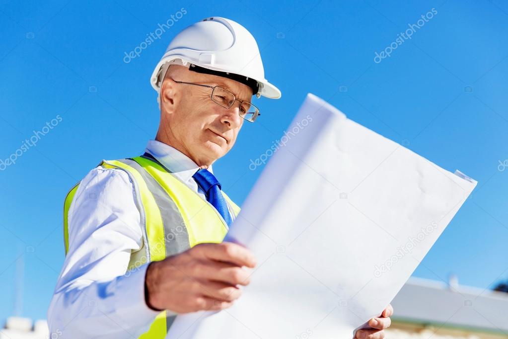 Engineer builder at construction site Stock Photo by ©SergeyNivens ...