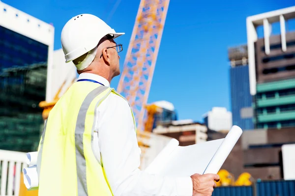 Engineer builder at construction site — Stock Photo © SergeyNivens ...