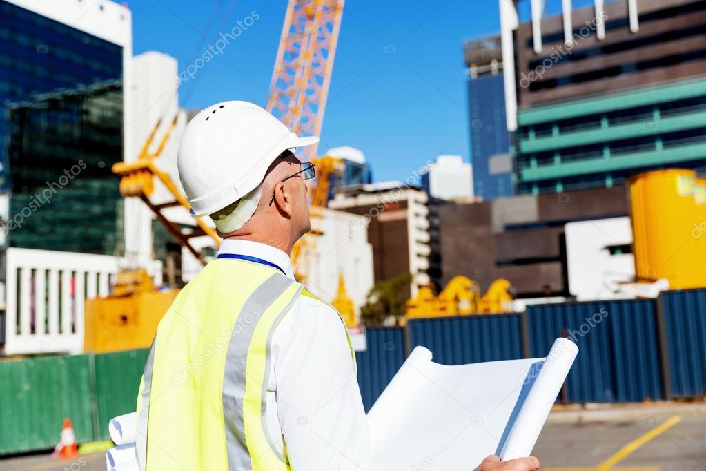 Engineer builder at construction site Stock Photo by ©SergeyNivens ...