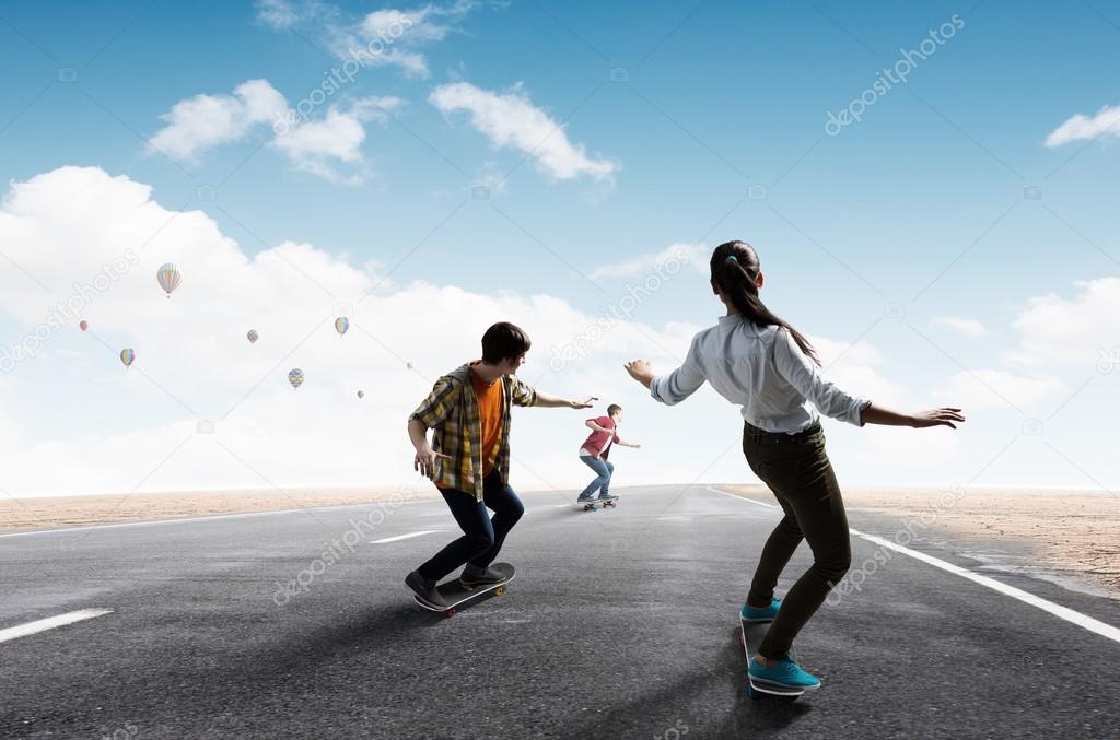 Young people riding skateboard — Stock Photo © SergeyNivens #108793692