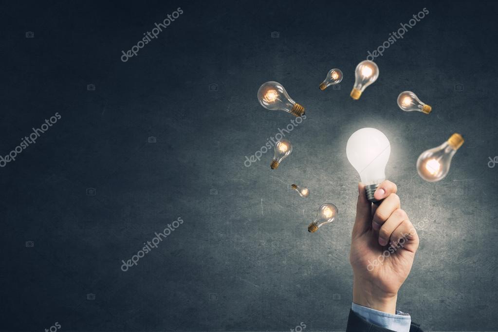 Glowing bulb in hand Stock Photo by ©SergeyNivens 109656290