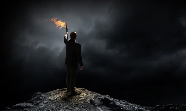 Man holding torch Stock Photos, Royalty Free Man holding torch Images ...