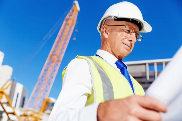 Engineer builder at construction site — Stock Photo © SergeyNivens ...